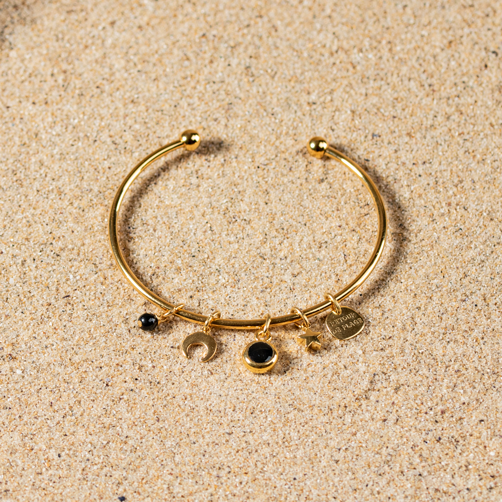 Bracelet doré et noir avec ses pendentifs fantaisies : Moon - Retour de ...