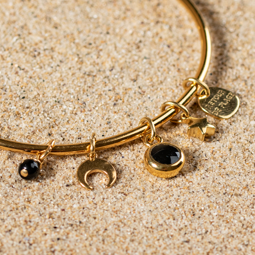 Bracelet doré et noir avec ses pendentifs fantaisies : Moon - Retour de ...